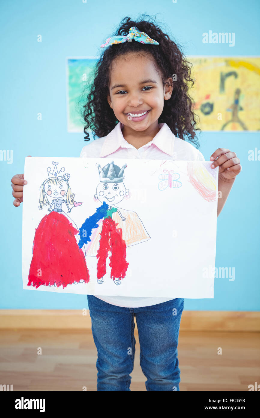 Cute girl showing her drawing Stock Photo - Alamy