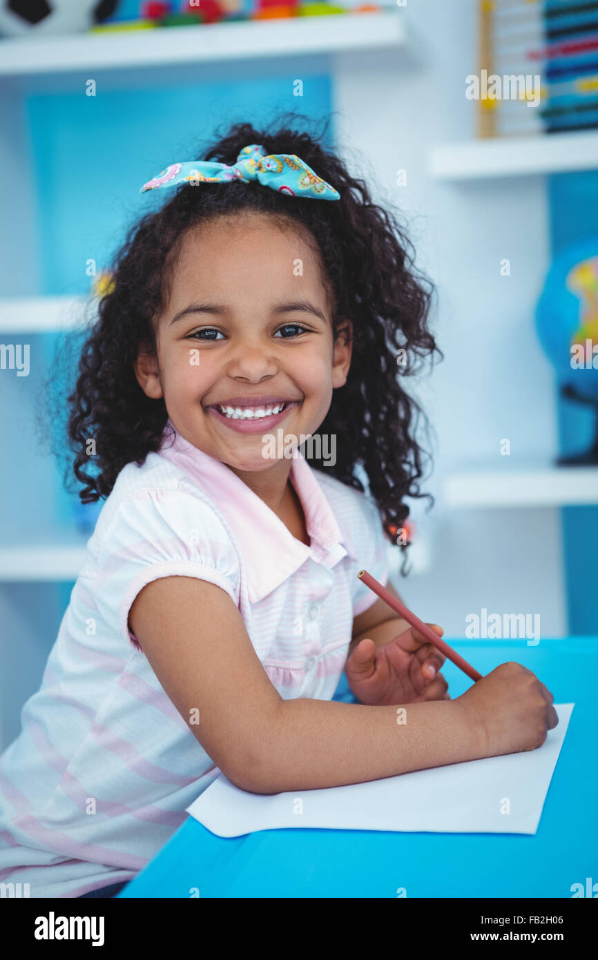 Beautiful girl sitting desk writing hi-res stock photography and images ...