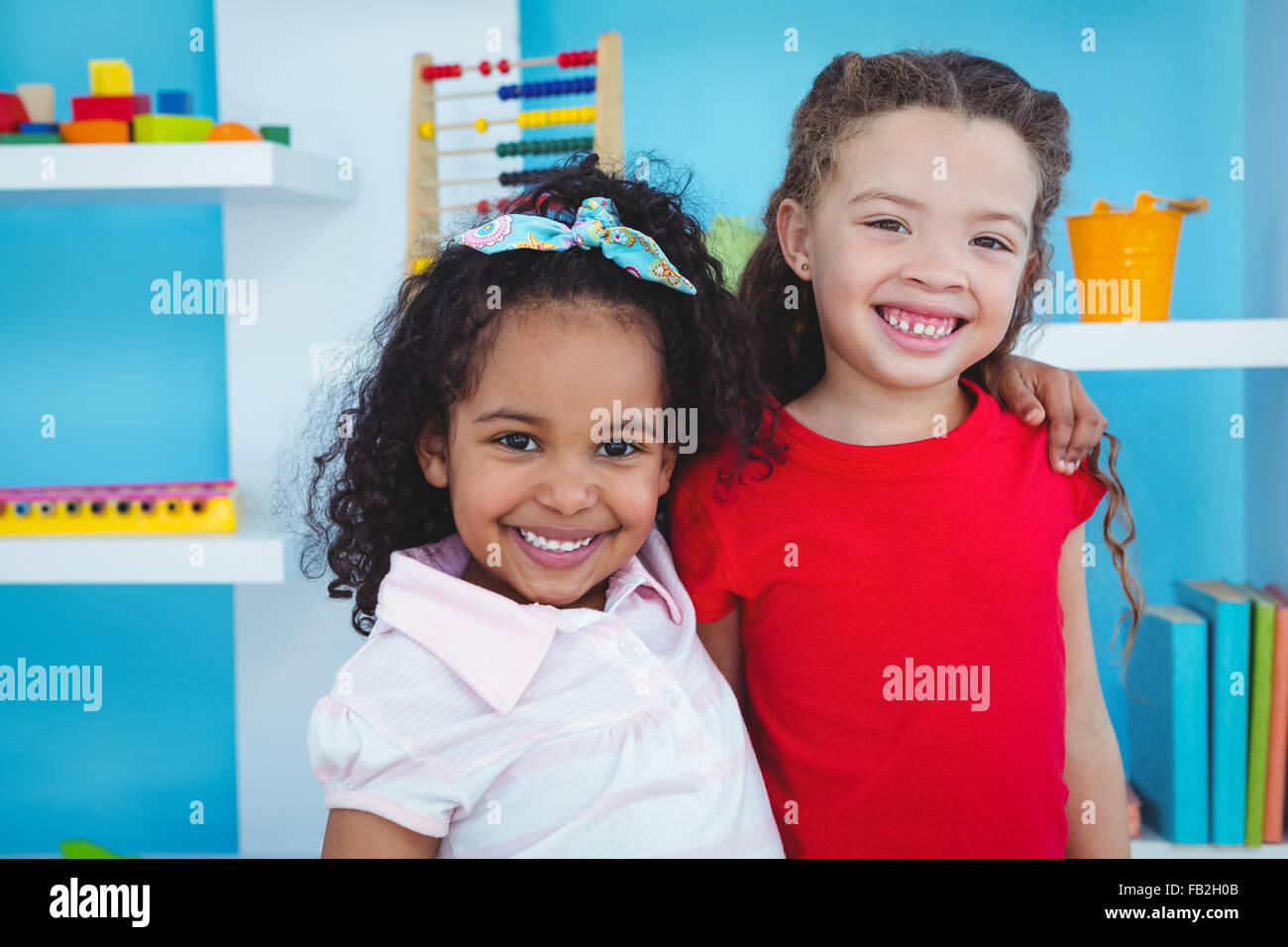 Cute girls smiling at the camera Stock Photo - Alamy