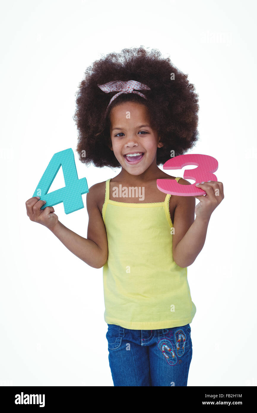 Cute girl standing holding sponge numbers Stock Photo - Alamy