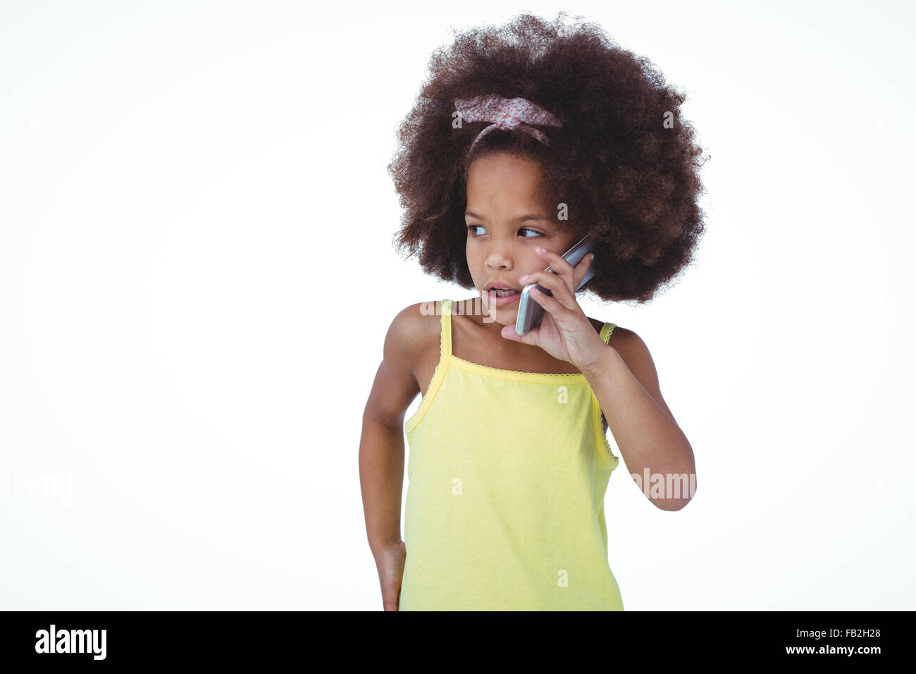 Cute girl on a phone call looking around Stock Photo - Alamy