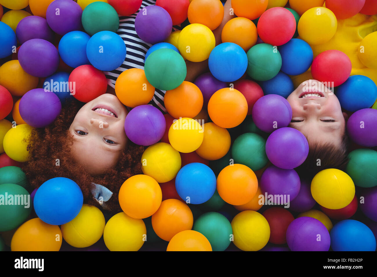 Kids playing with ball in pool hi-res stock photography and images - Alamy