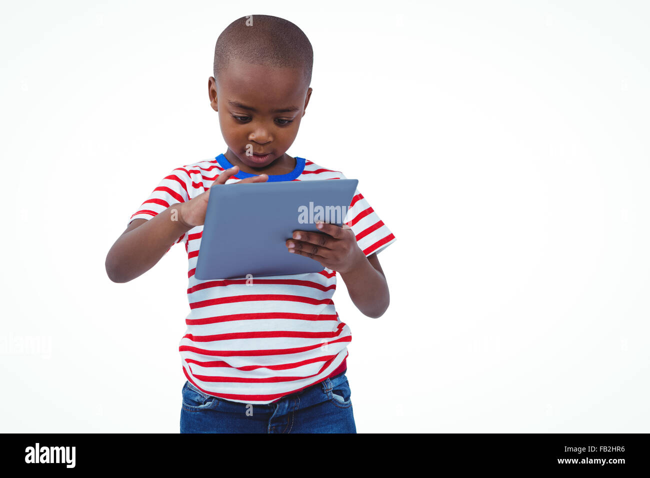 Standing boy using tablet Stock Photo - Alamy