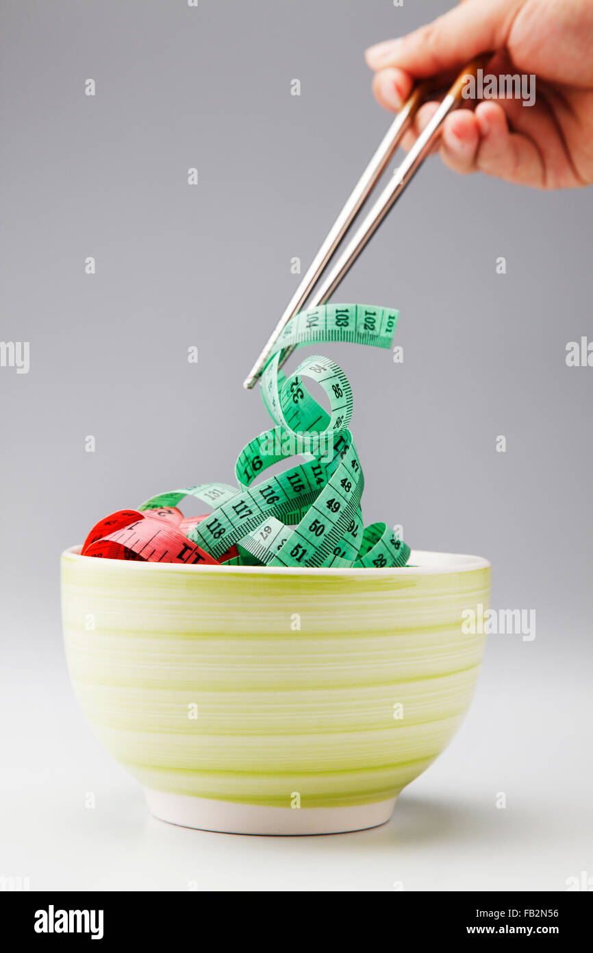 stock image of the chopstick and measuring tape Stock Photo - Alamy