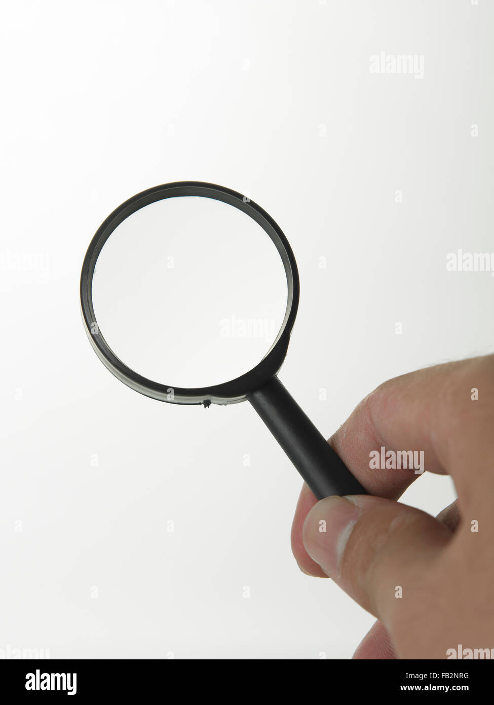 hand holding a magnifier glass Stock Photo - Alamy