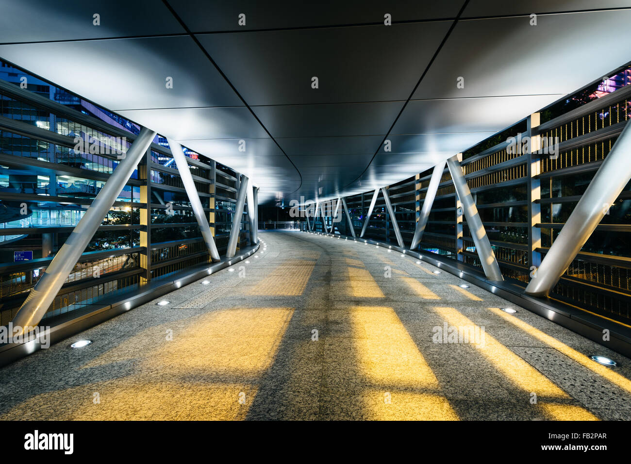 Covered pedestrian bridge at night, in Hong Kong, Hong Kong Stock Photo ...
