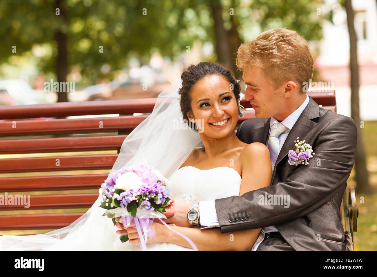 Bride and groom on the bench Stock Photo - Alamy
