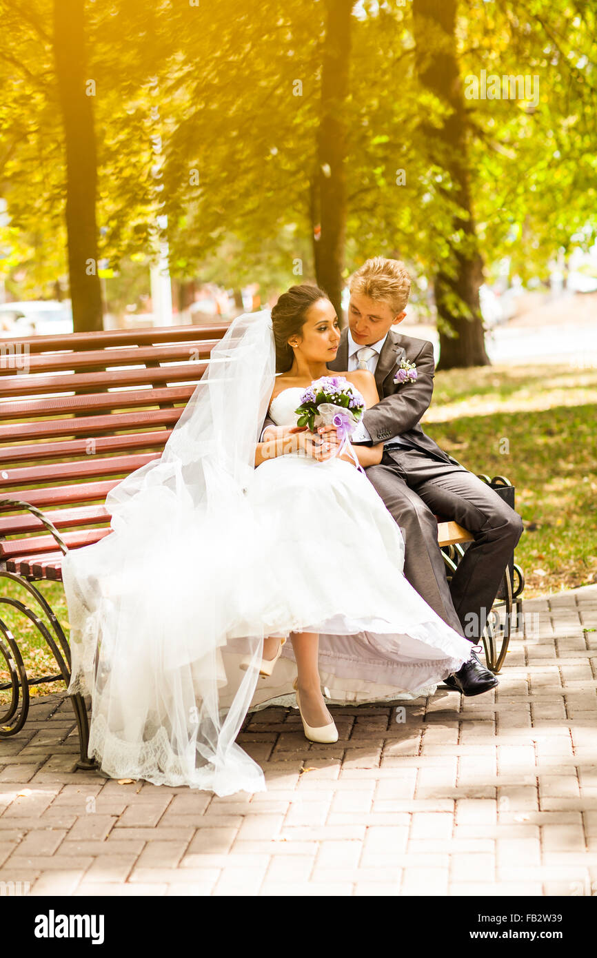 Bride and groom on the bench Stock Photo - Alamy
