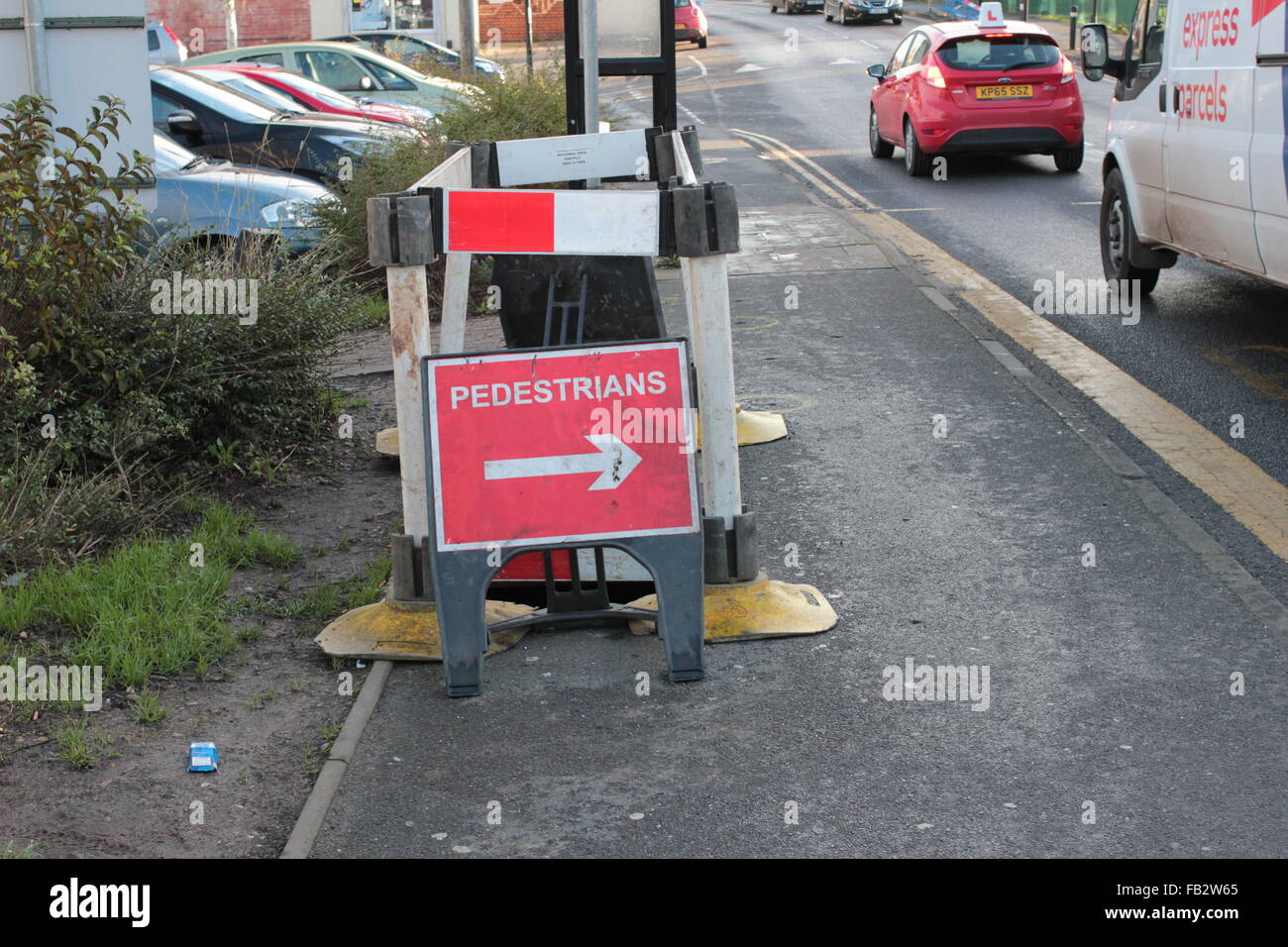 Red public sign for works Stock Photo - Alamy