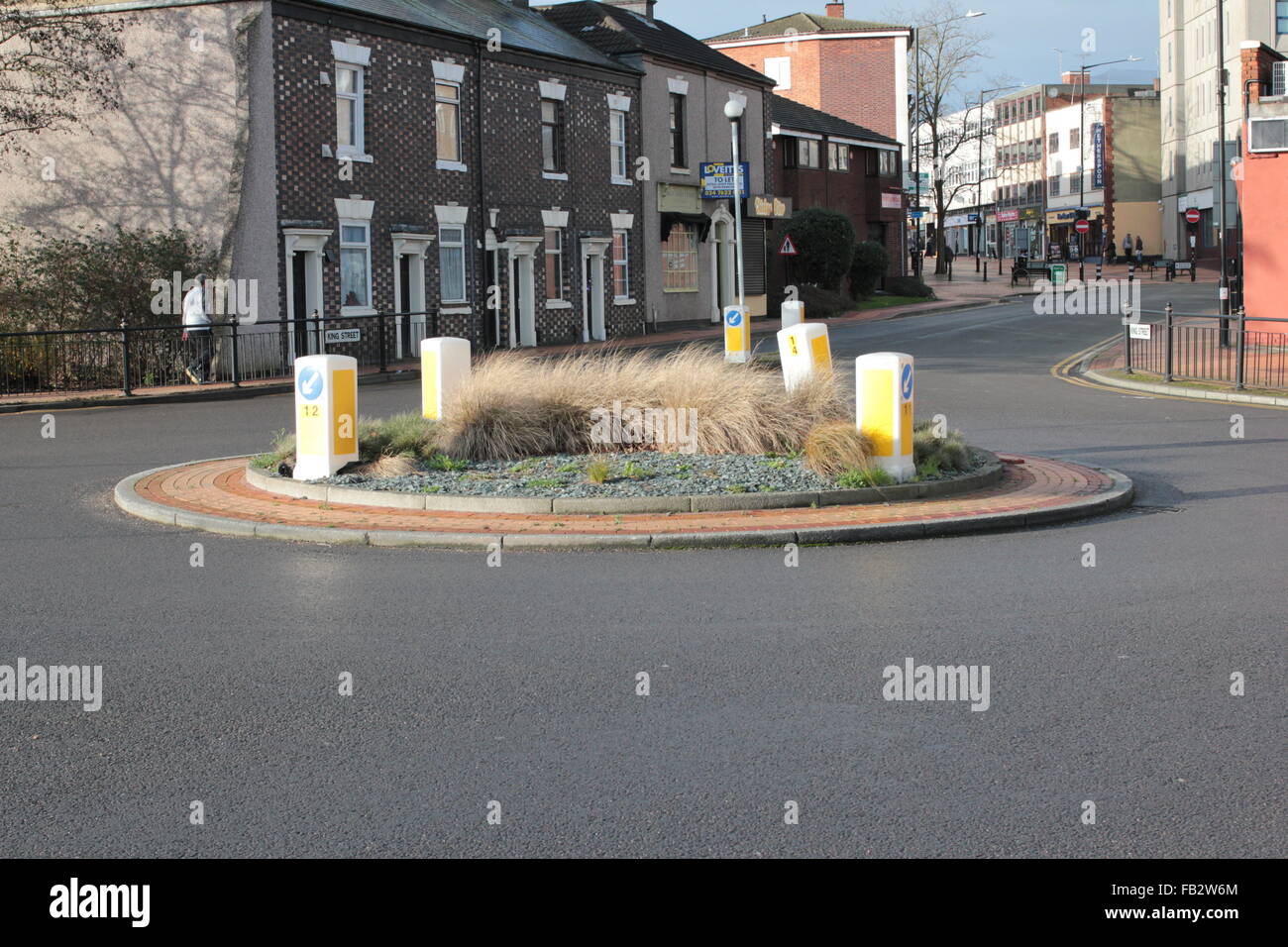 Traffic island with bollards Stock Photo - Alamy