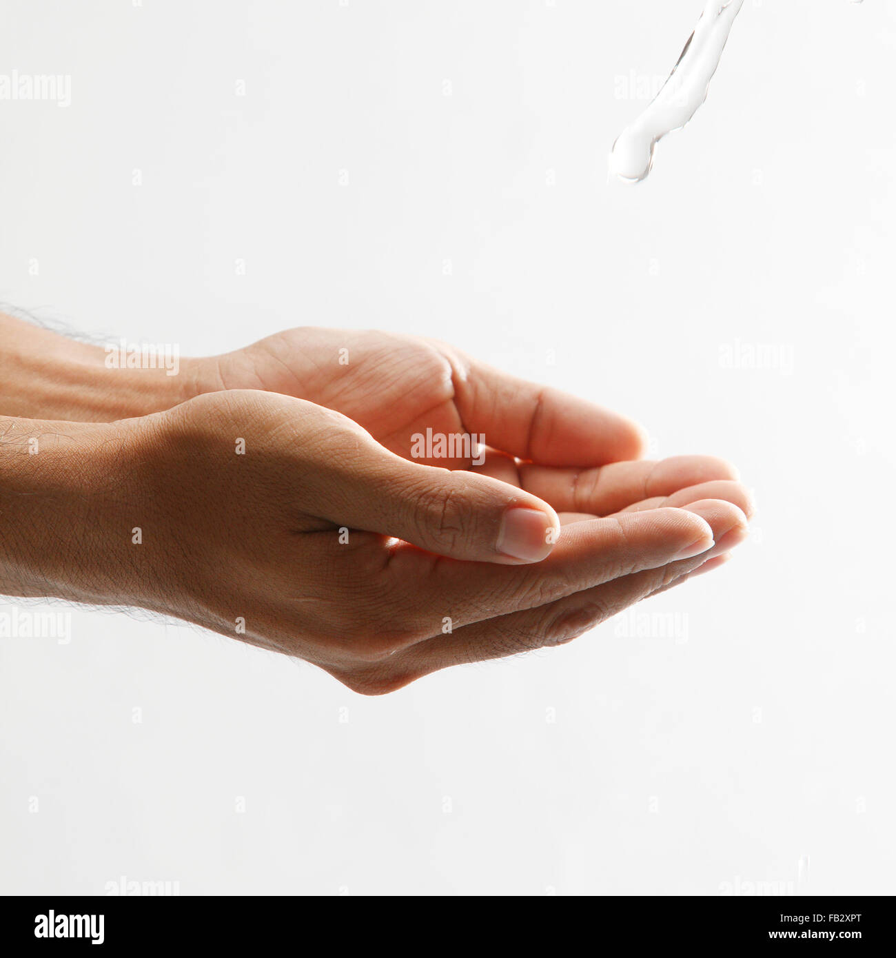 hand cupped waiting water to pour Stock Photo - Alamy
