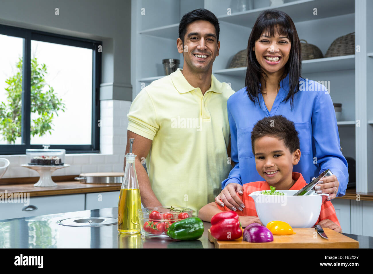 Happy indian family in kitchen hi-res stock photography and images - Alamy