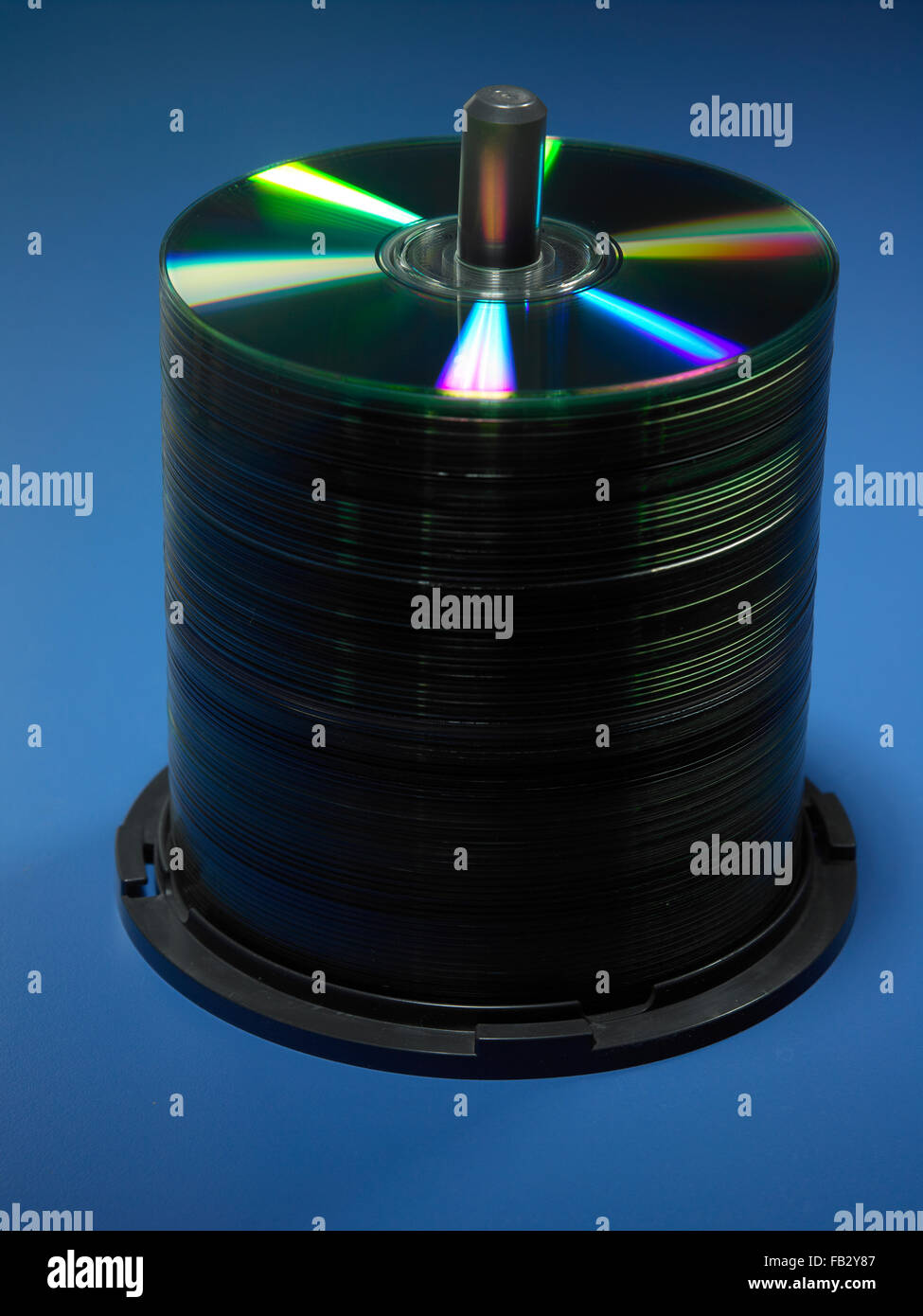 stack of cd or dvd on the blue background Stock Photo - Alamy