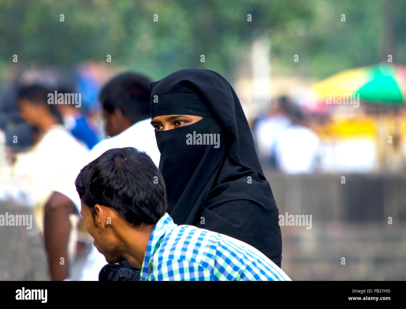the woman the muslim in national clothes,the woman,the man,the muslim ...