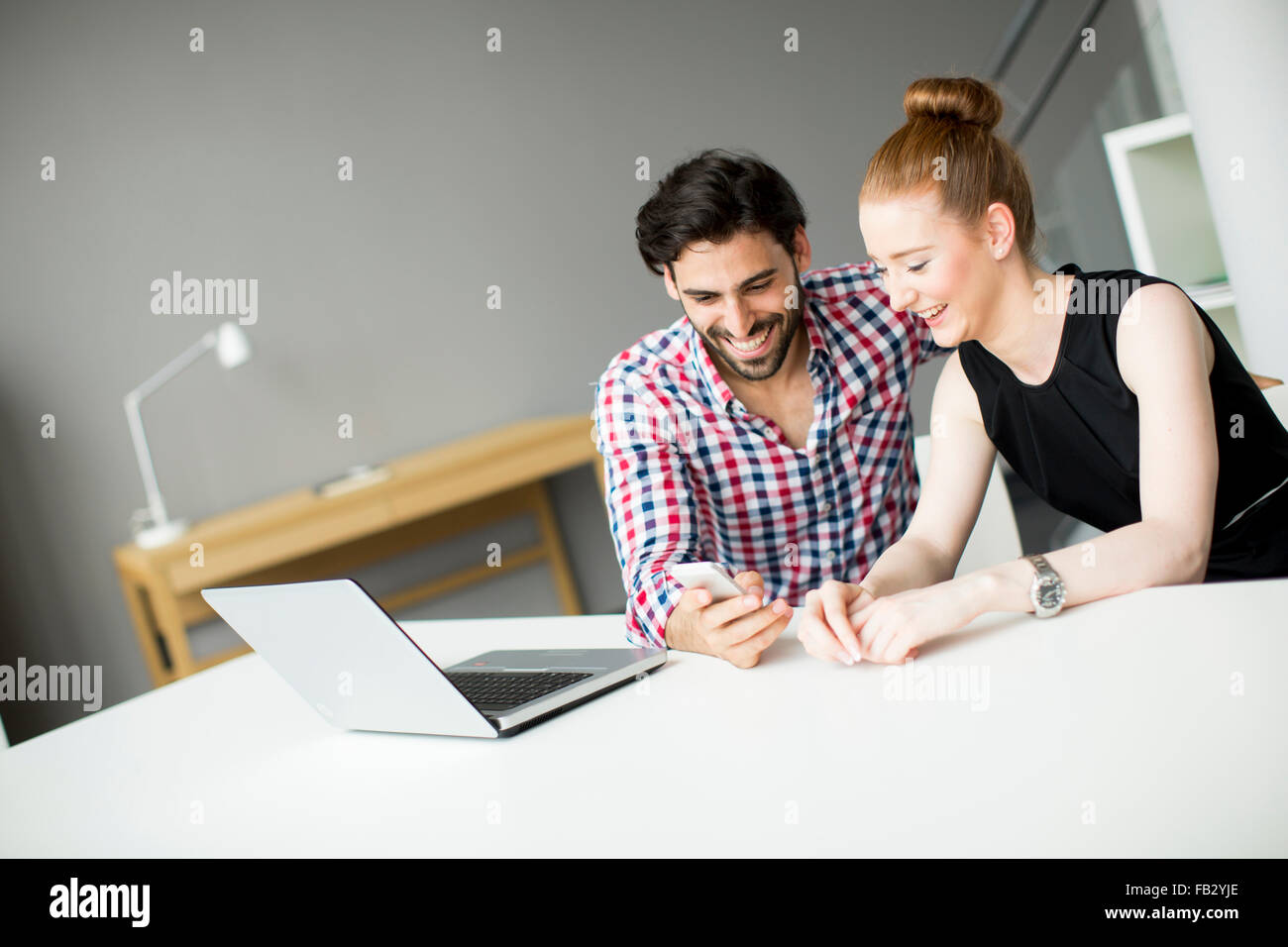 Young people in the office Stock Photo - Alamy