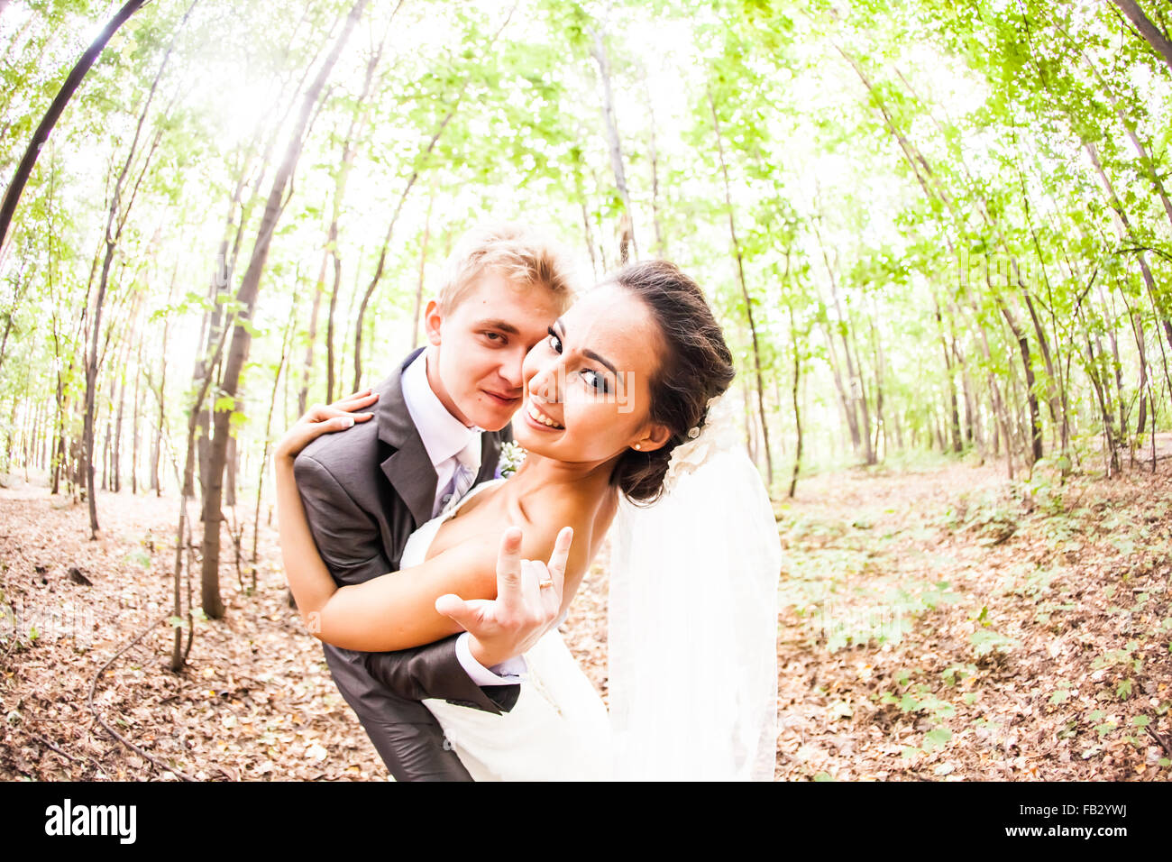 Newlywed couple going crazy. Groom and bride together Stock Photo - Alamy