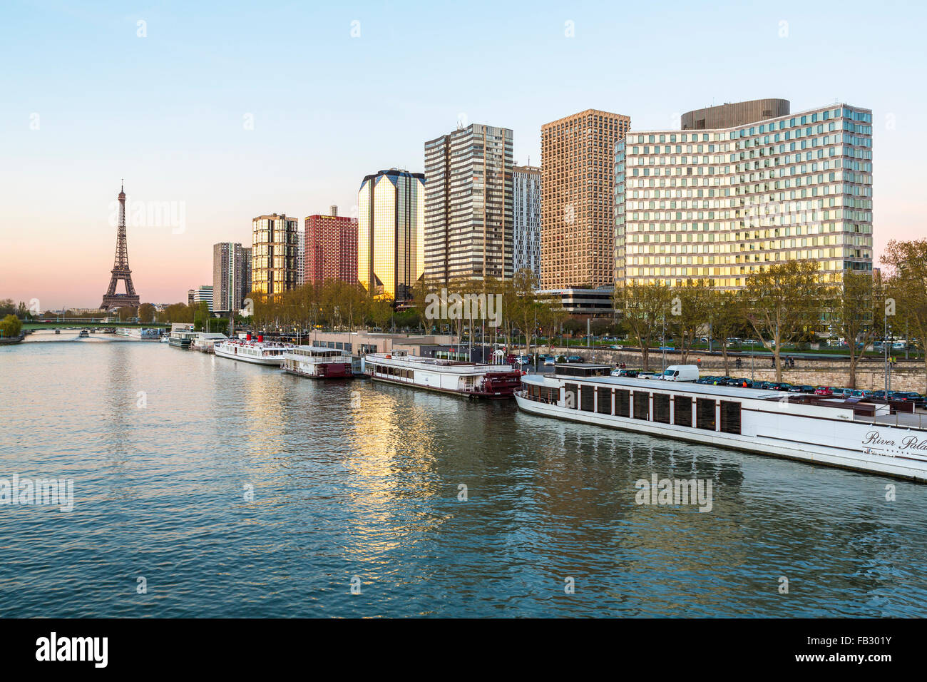 Evening view of River Seine with high-rise buildings on the Left Bank ...