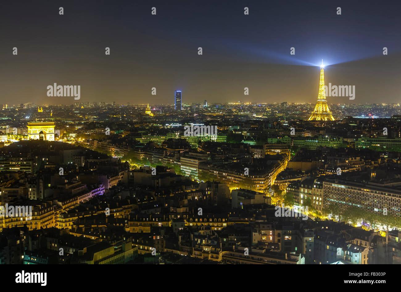 Paris elevated night city skyline, the illuminated Eiffel tower and Arc de Triomphe, France ...