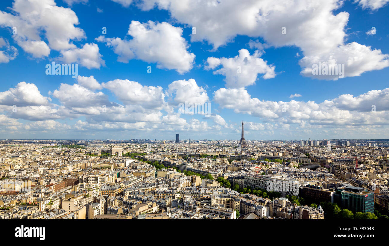 Arc de Triomphe and the Eiffel Tower, elevated city skyline viewed over rooftops, Paris, France ...