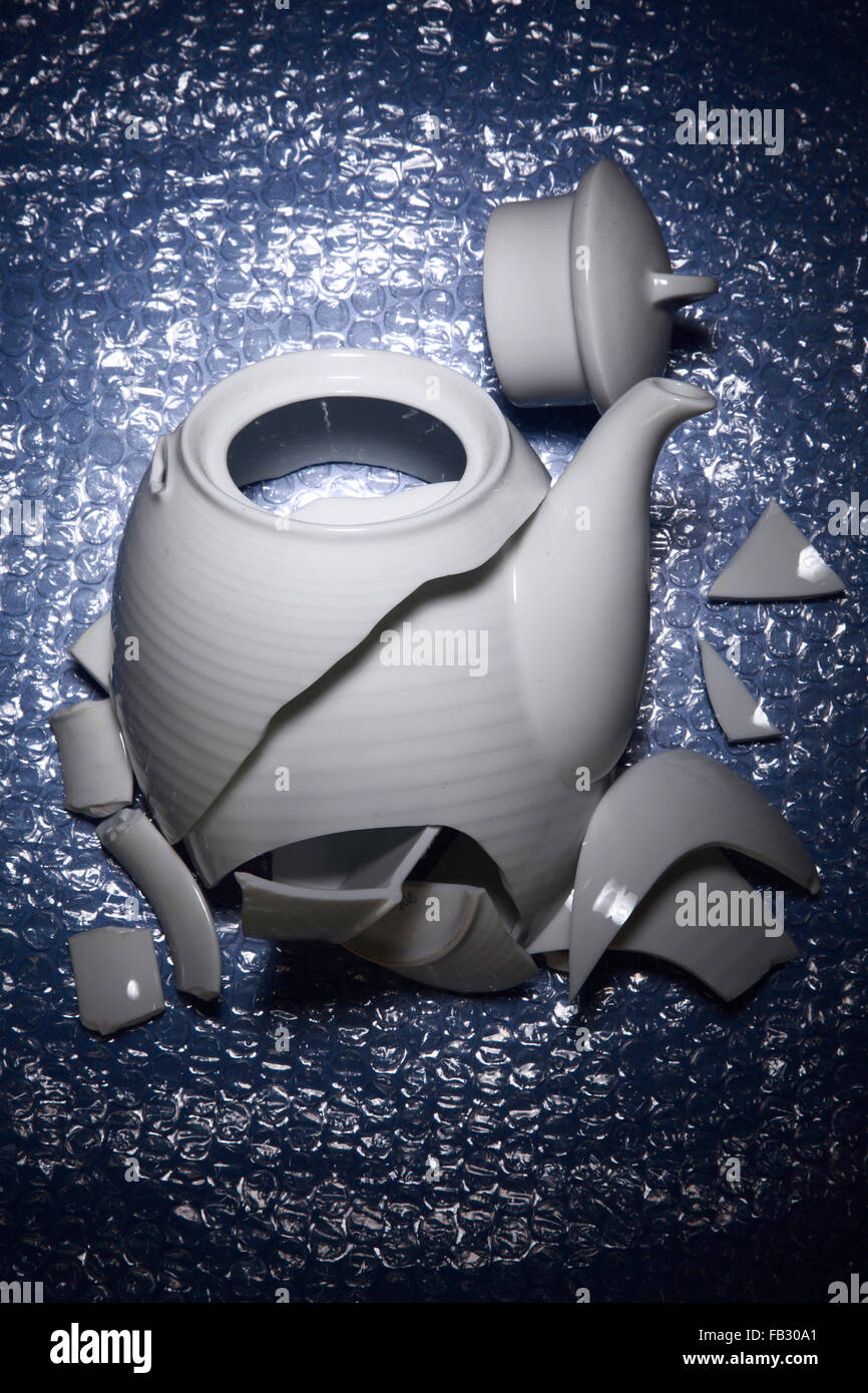 broken tea pot on the buble wrap Stock Photo - Alamy