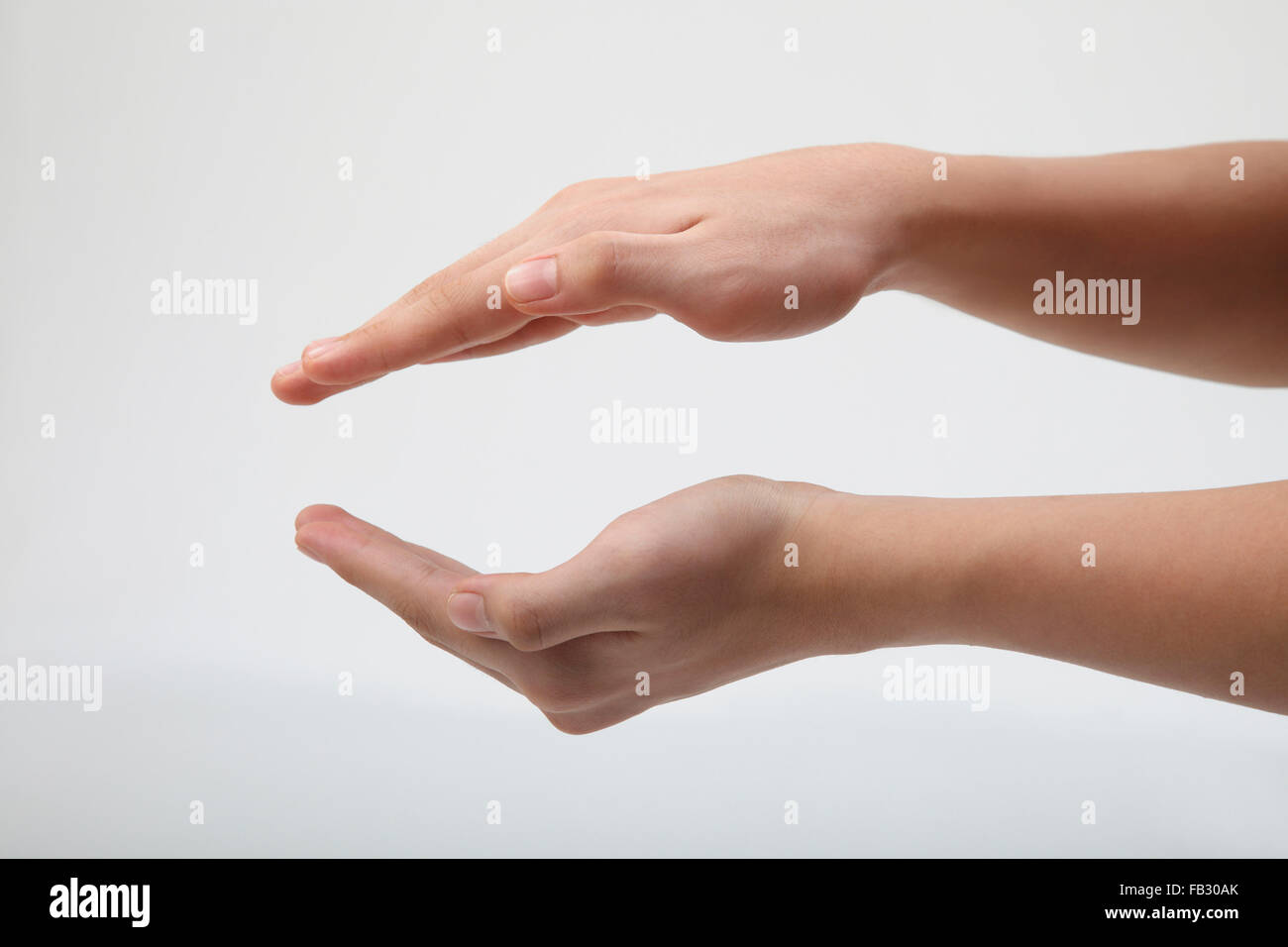 two hand form a protection shield Stock Photo - Alamy