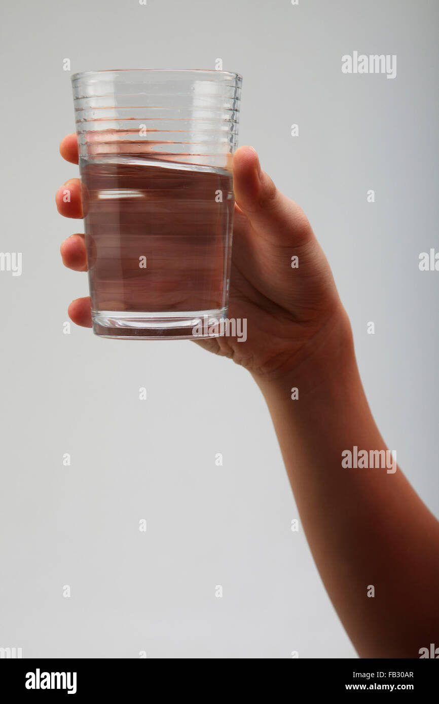 hand holding glass of water Stock Photo - Alamy