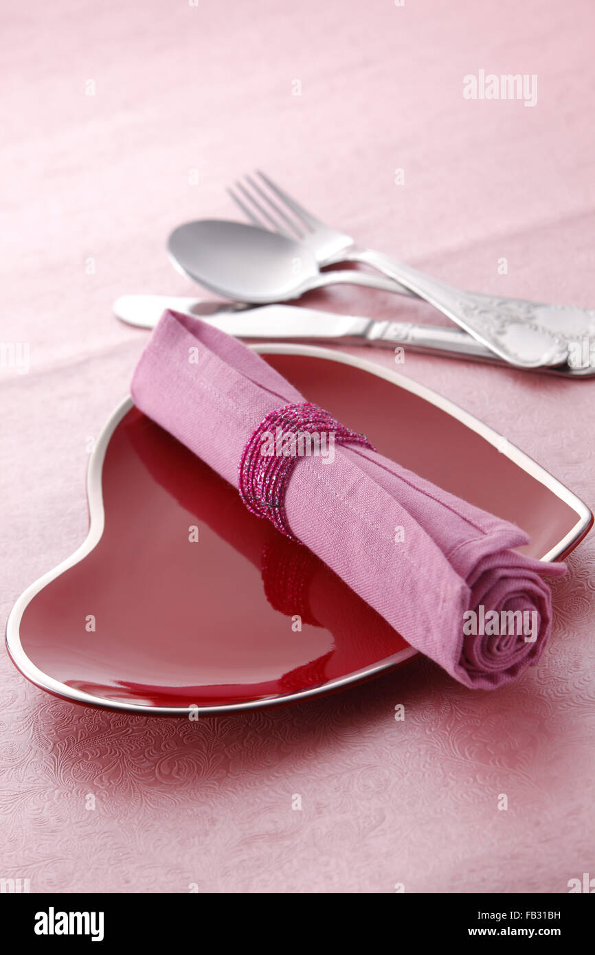 plate with love shape and cutlery Stock Photo - Alamy
