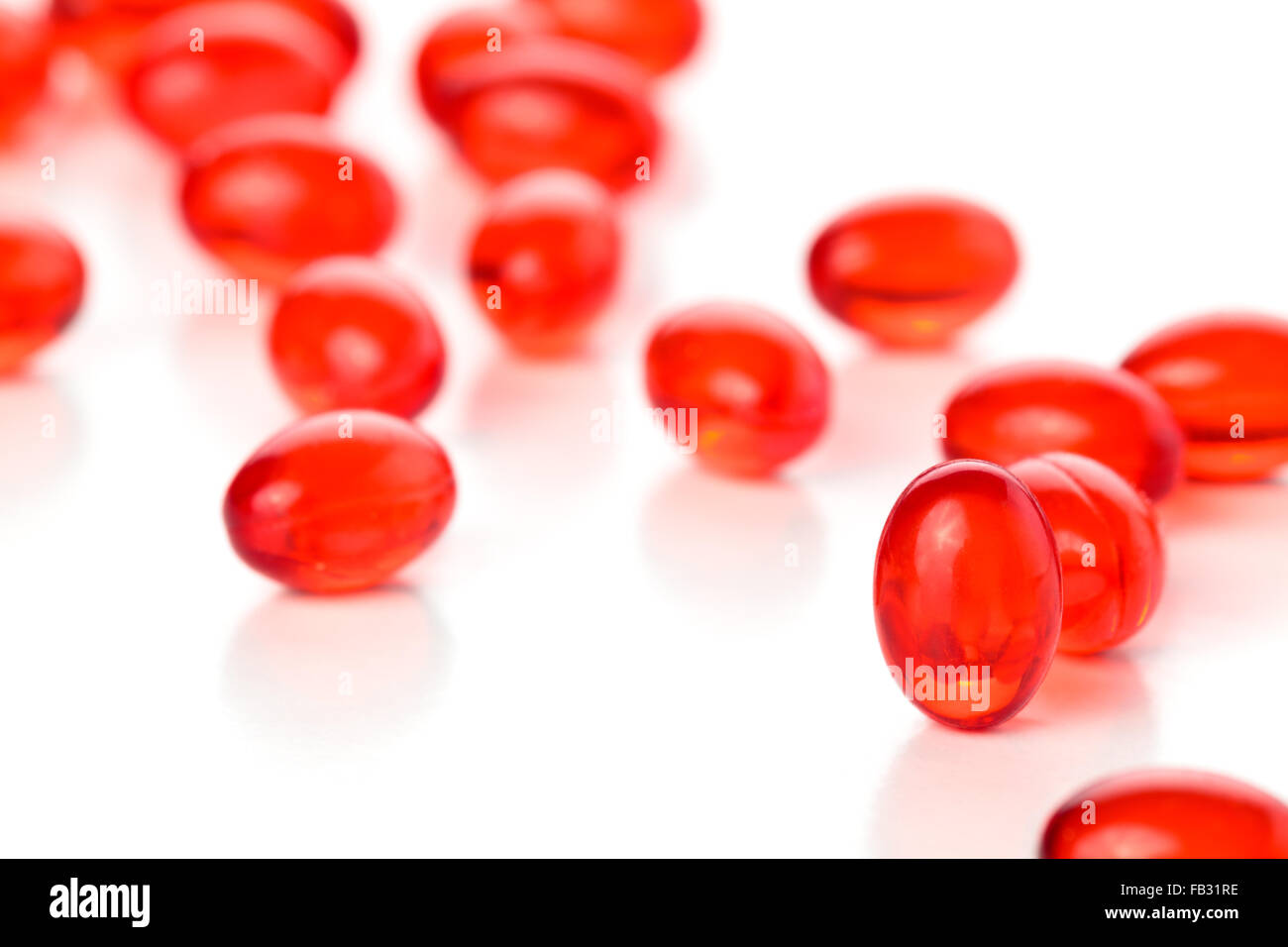 Close up shot of red capsules Stock Photo - Alamy