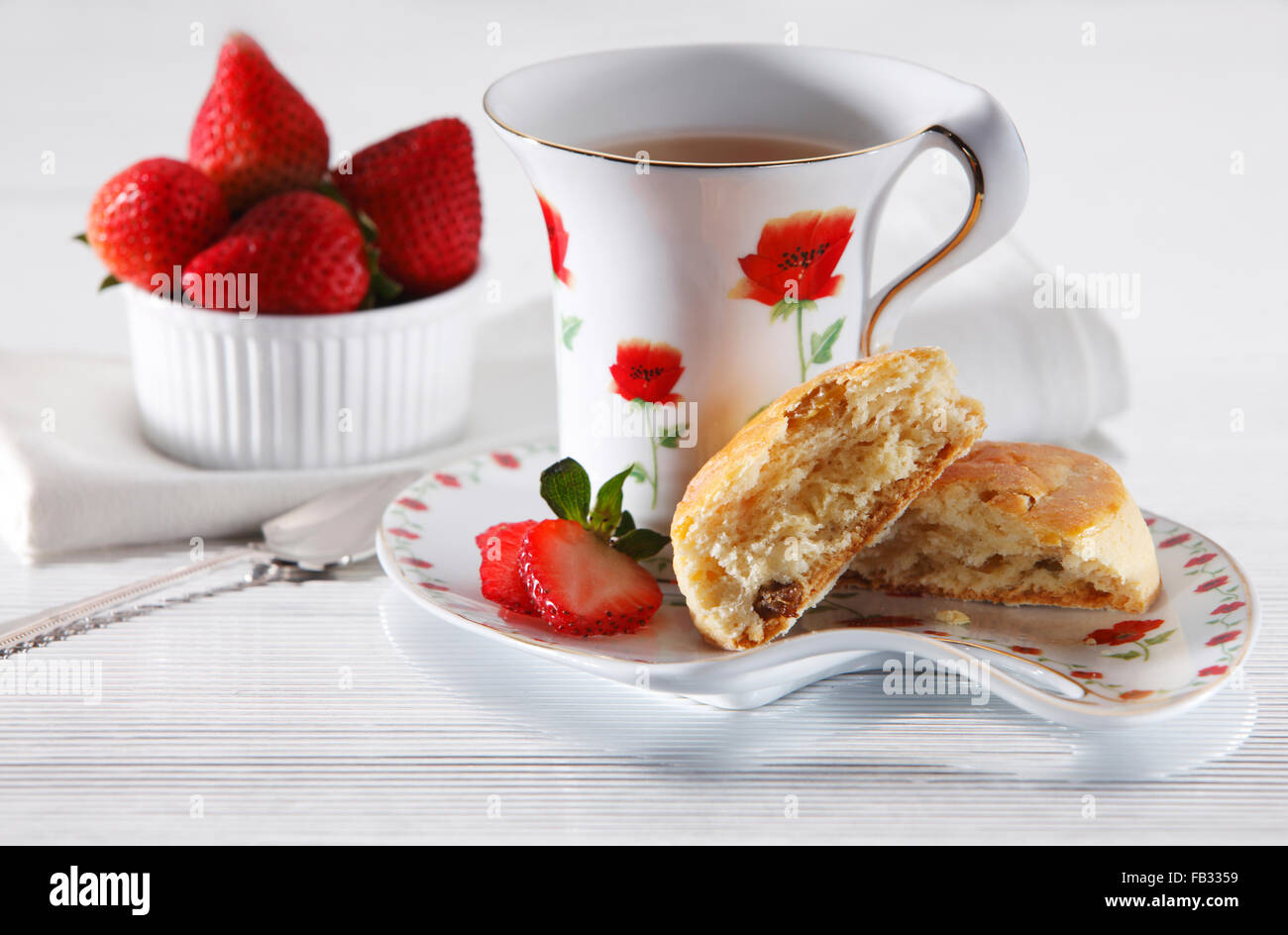 Scones decorated with strawberry and coffee Stock Photo - Alamy