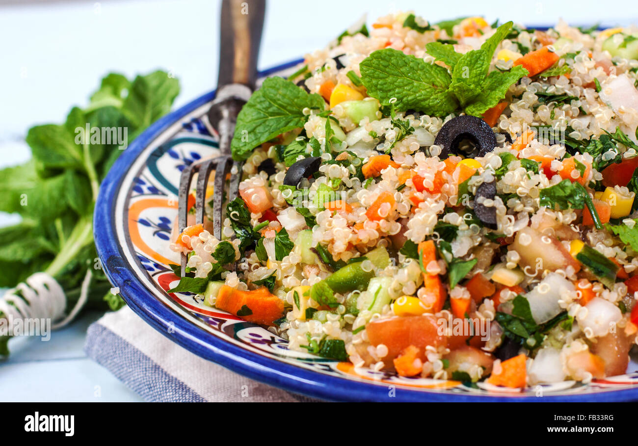 fresh quinoa salad taboule style with vegetables on bowl Stock Photo ...