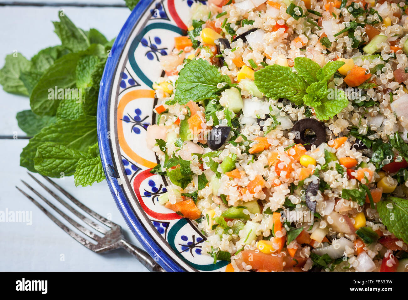fresh quinoa salad taboule style with vegetables on bowl Stock Photo ...