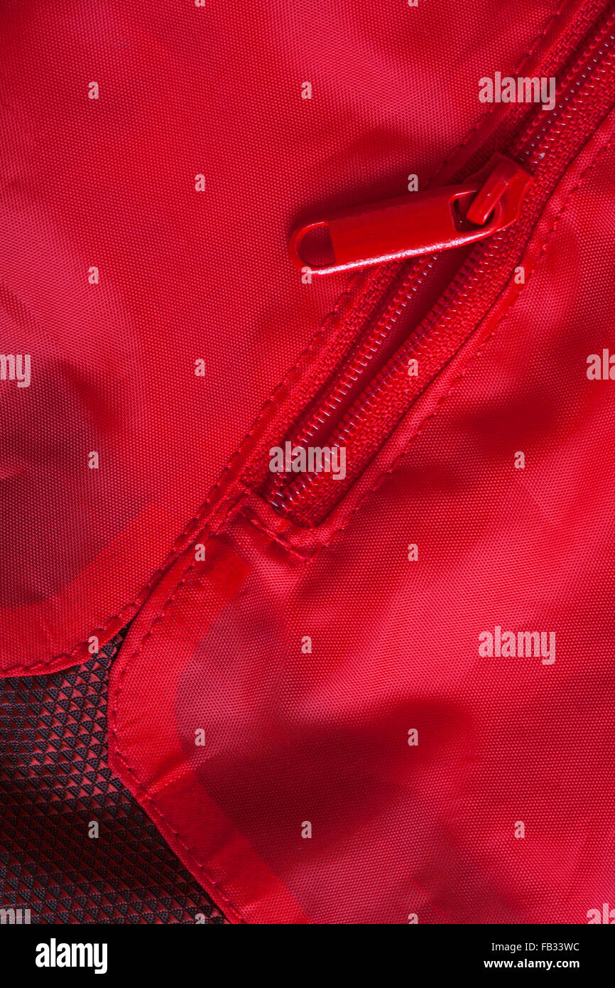 red zip zipper close up of jacket pocket Stock Photo - Alamy