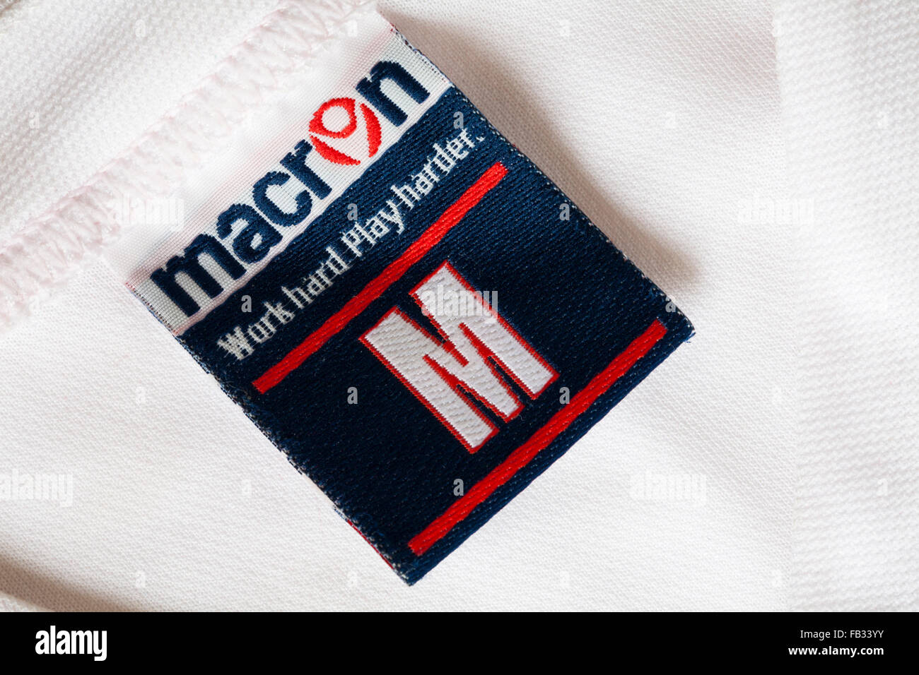 label in garment - Macron work hard play harder M Stock Photo - Alamy