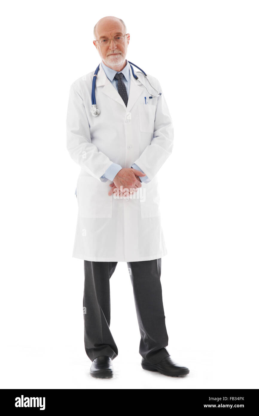 Full length portrait of a mature doctor isolated on white background ...