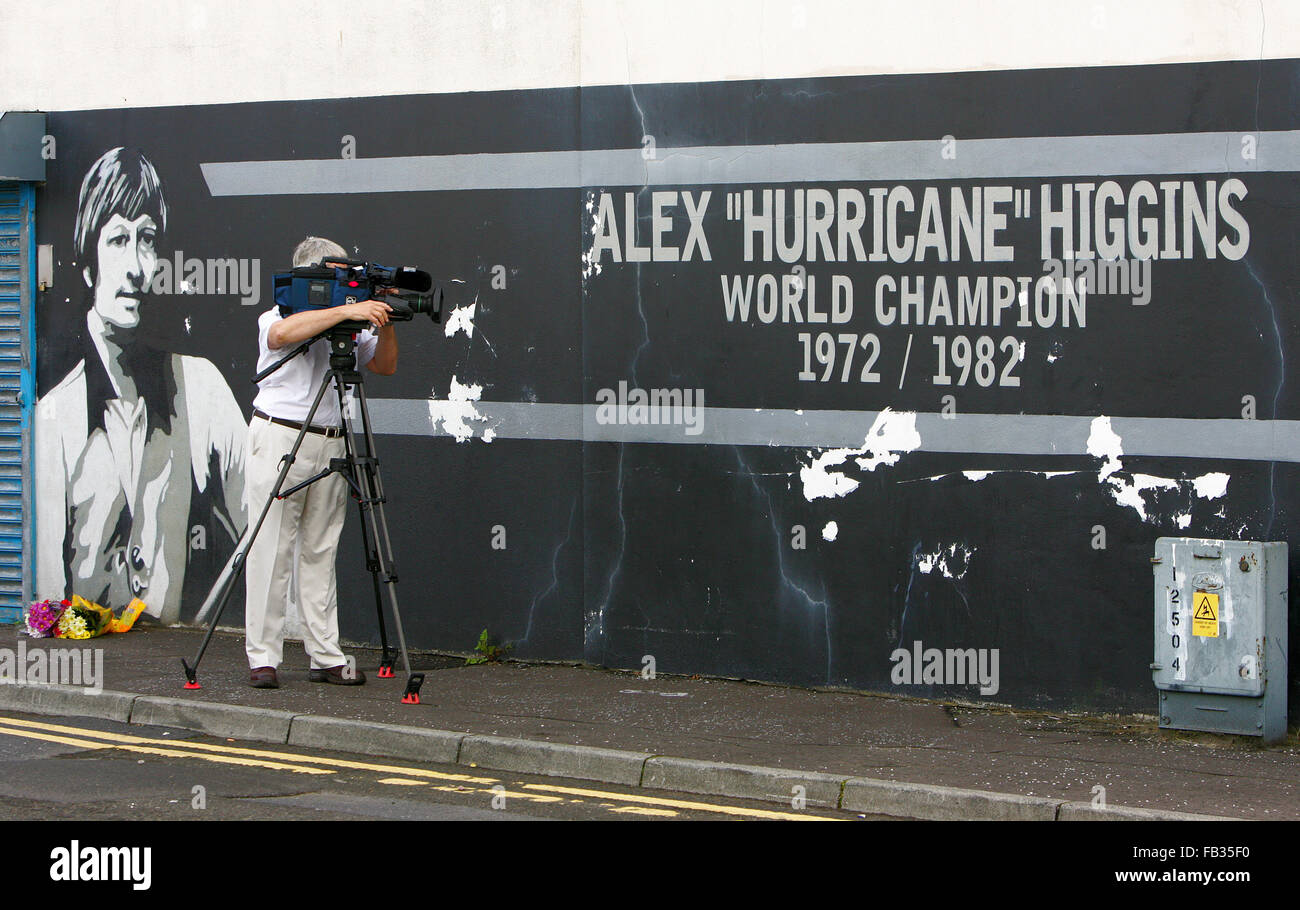Flowers are laid beneath mural of snooker champion alex higgins hi-res ...