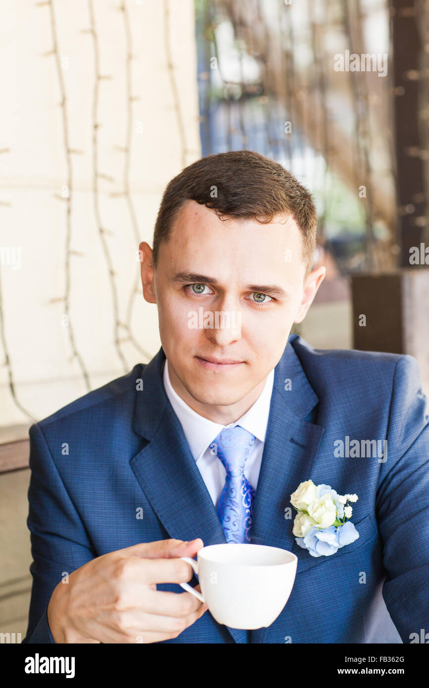 groom drinking coffee Stock Photo - Alamy