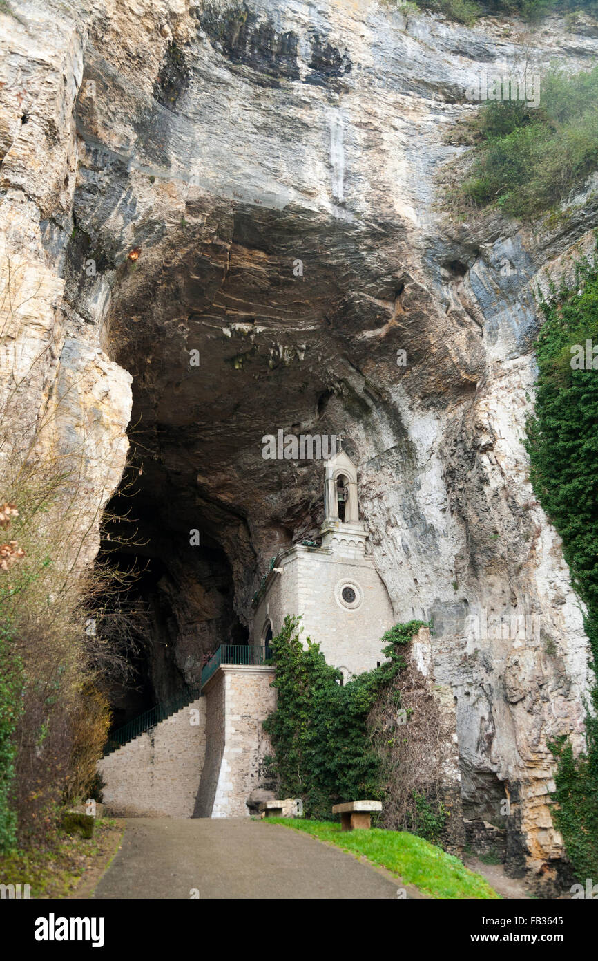 Cave entrance seen from exterior / outside with a chapel; Caves of La ...