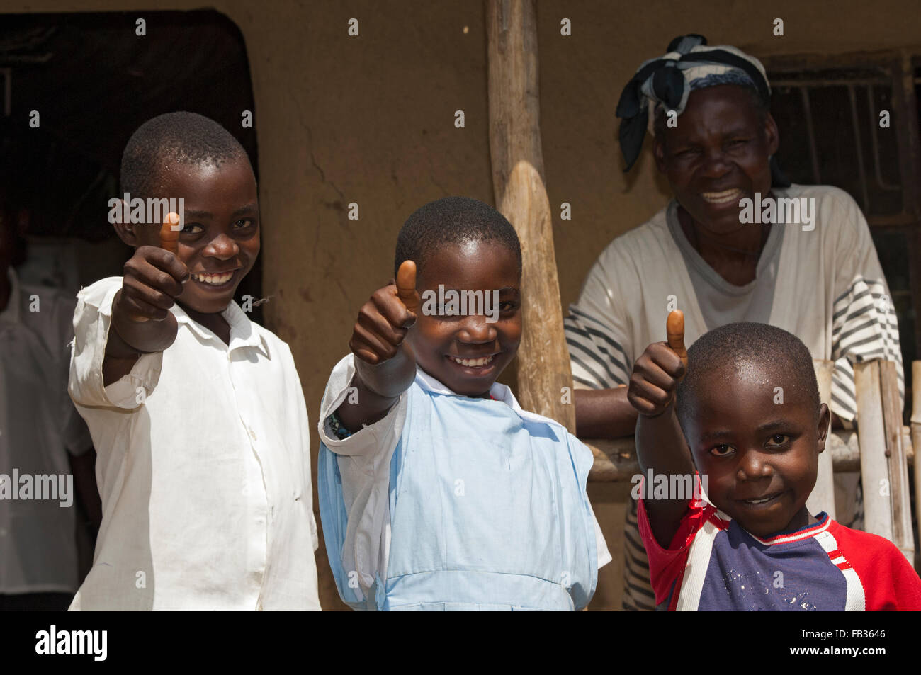 Group of happy looking children with their thumbs up. Bumala, Kenya ...