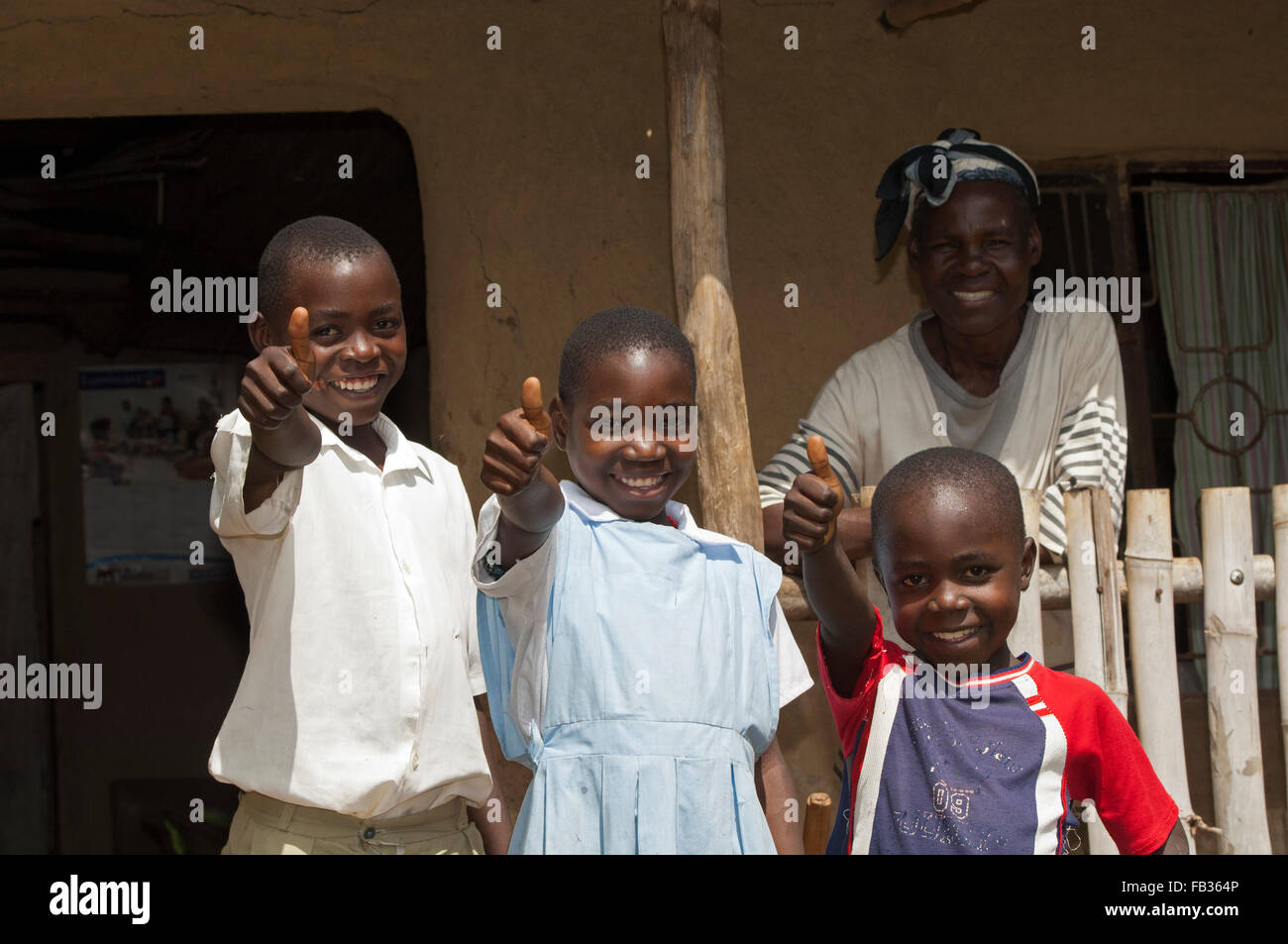 Group of happy looking children with their thumbs up. Bumala, Kenya ...