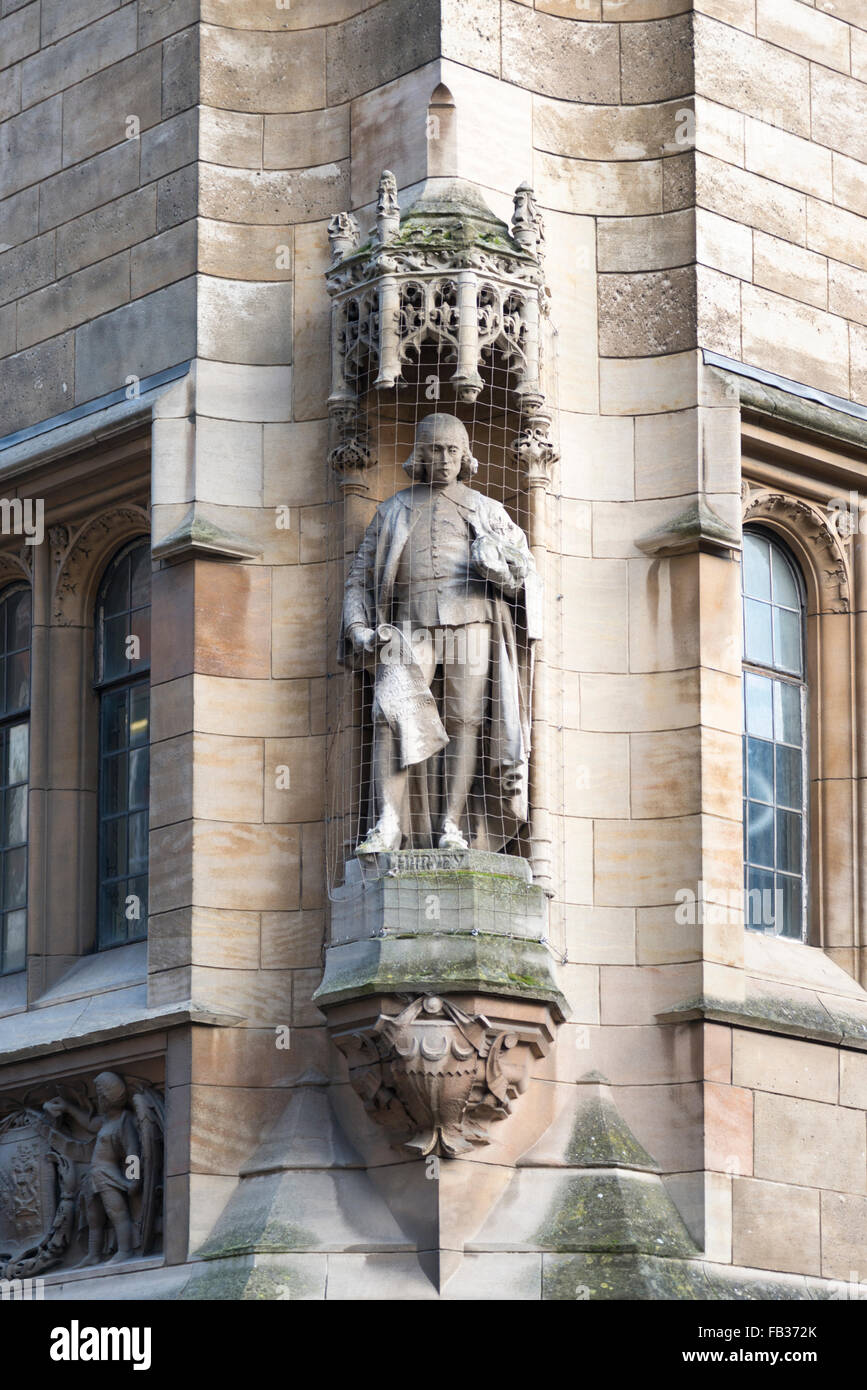 A stone statue on a building at Cambridge University UK Stock Photo - Alamy