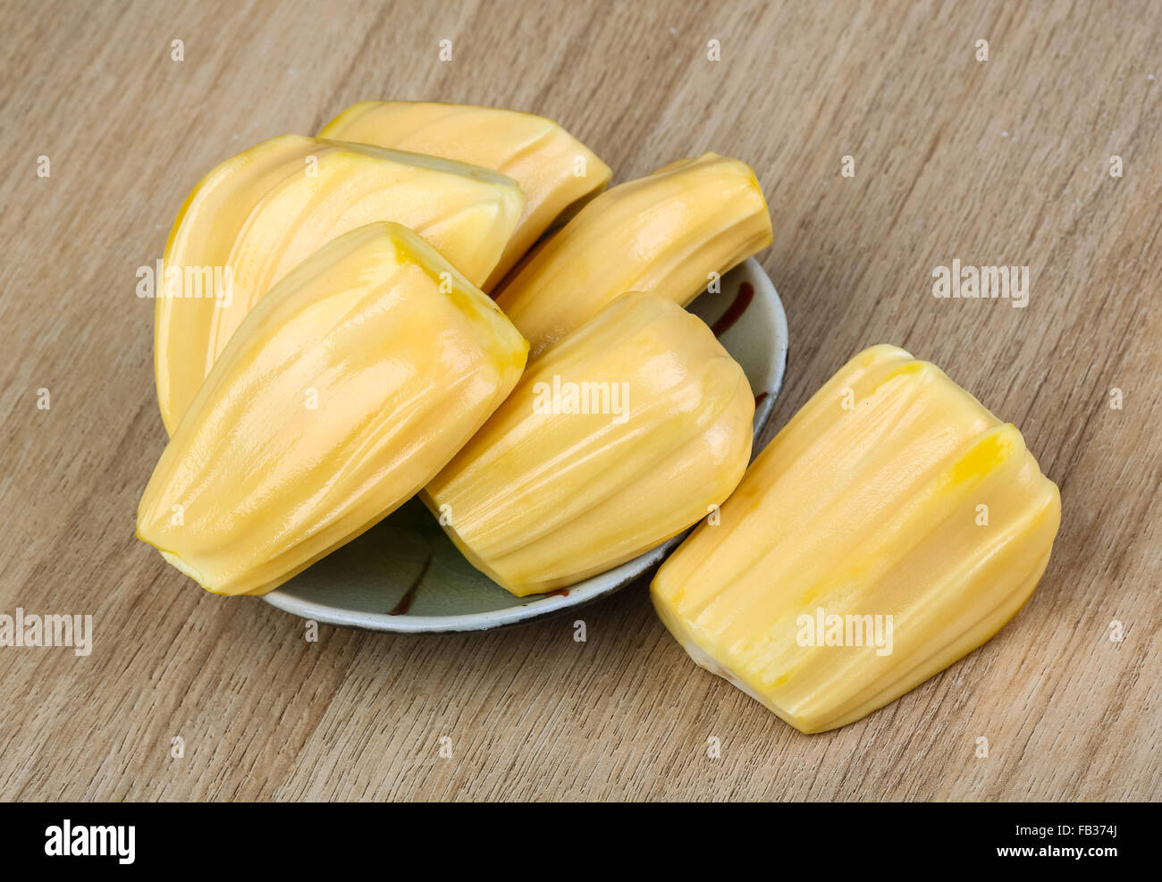Tropical Jack Fruit on the wood background Stock Photo - Alamy