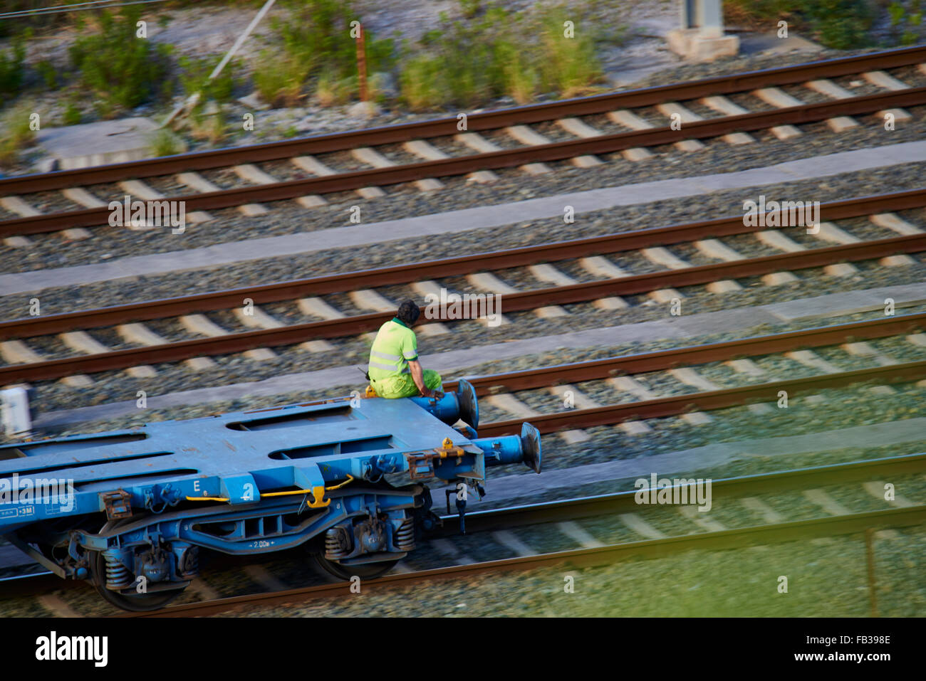 Worker sitting on a Freight train Stock Photo - Alamy