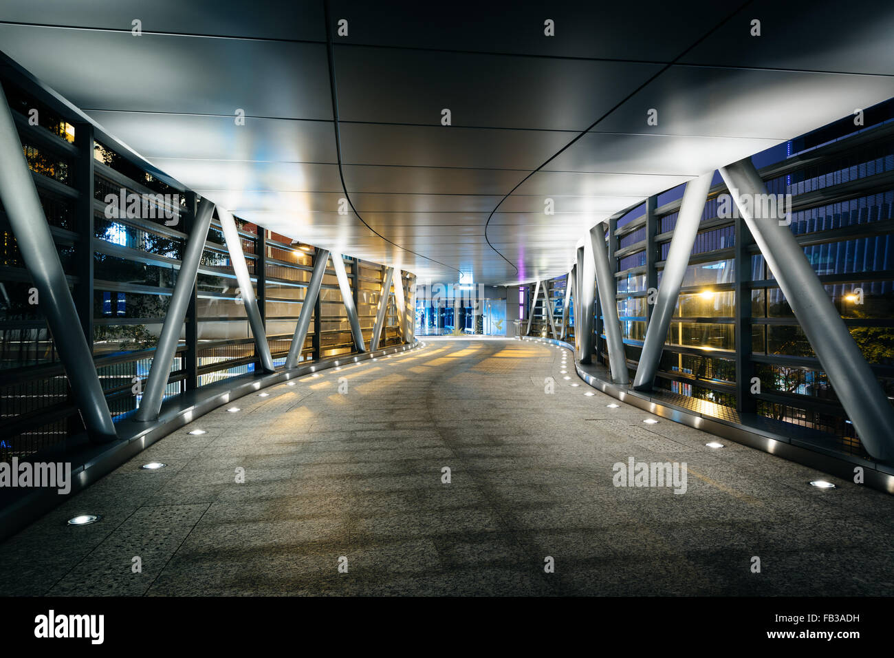Covered pedestrian bridge at night, in Hong Kong, Hong Kong Stock Photo ...