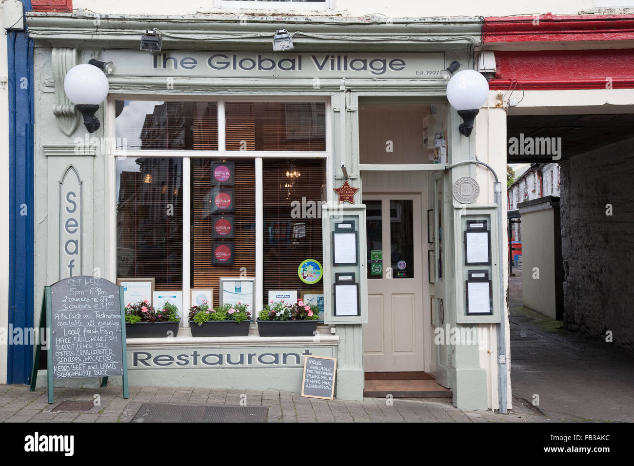 Global Village Restaurant Sign; Dingle; Ireland Stock Photo - Alamy