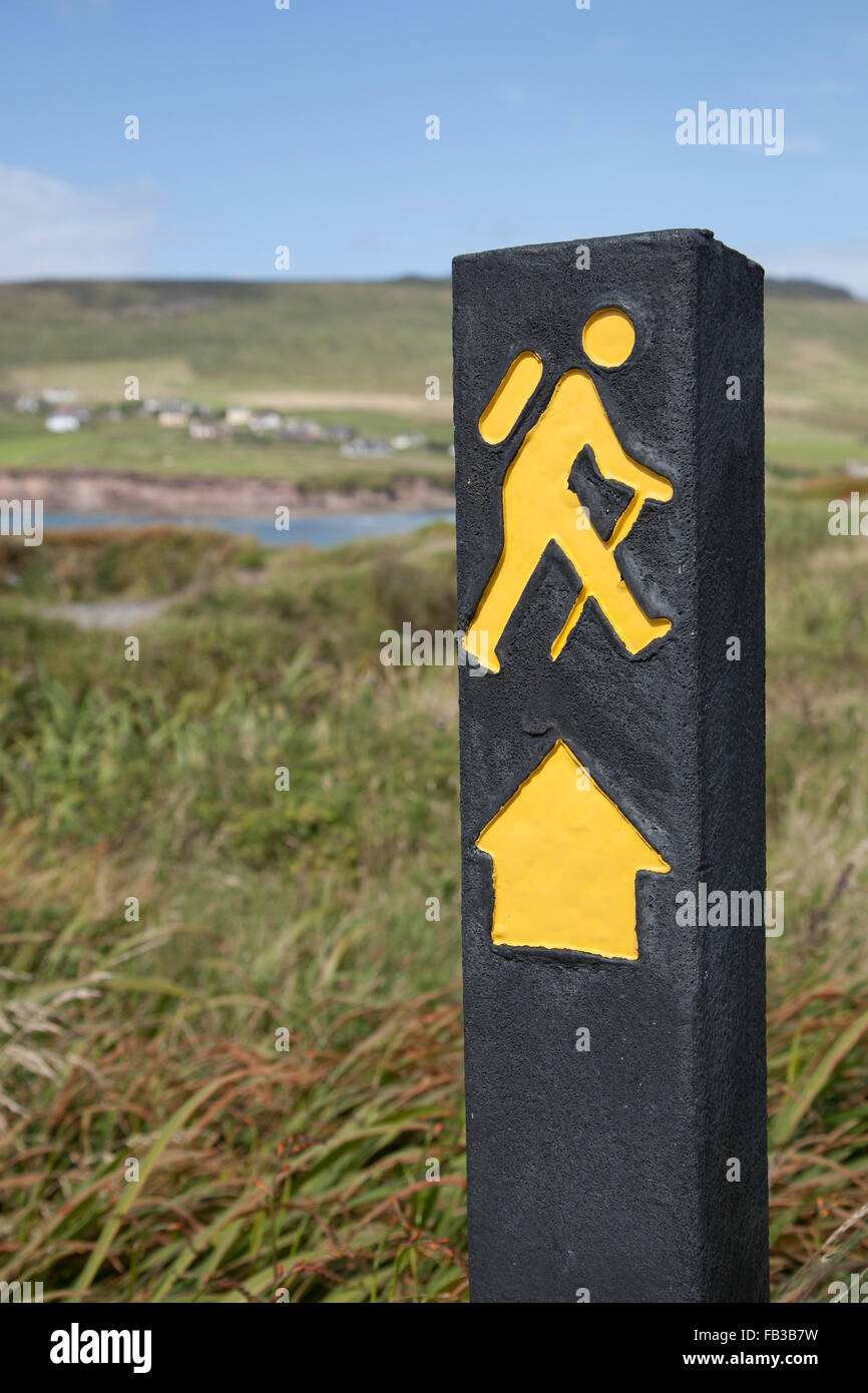 Yellow Hiking Sign with Rural Background Stock Photo - Alamy