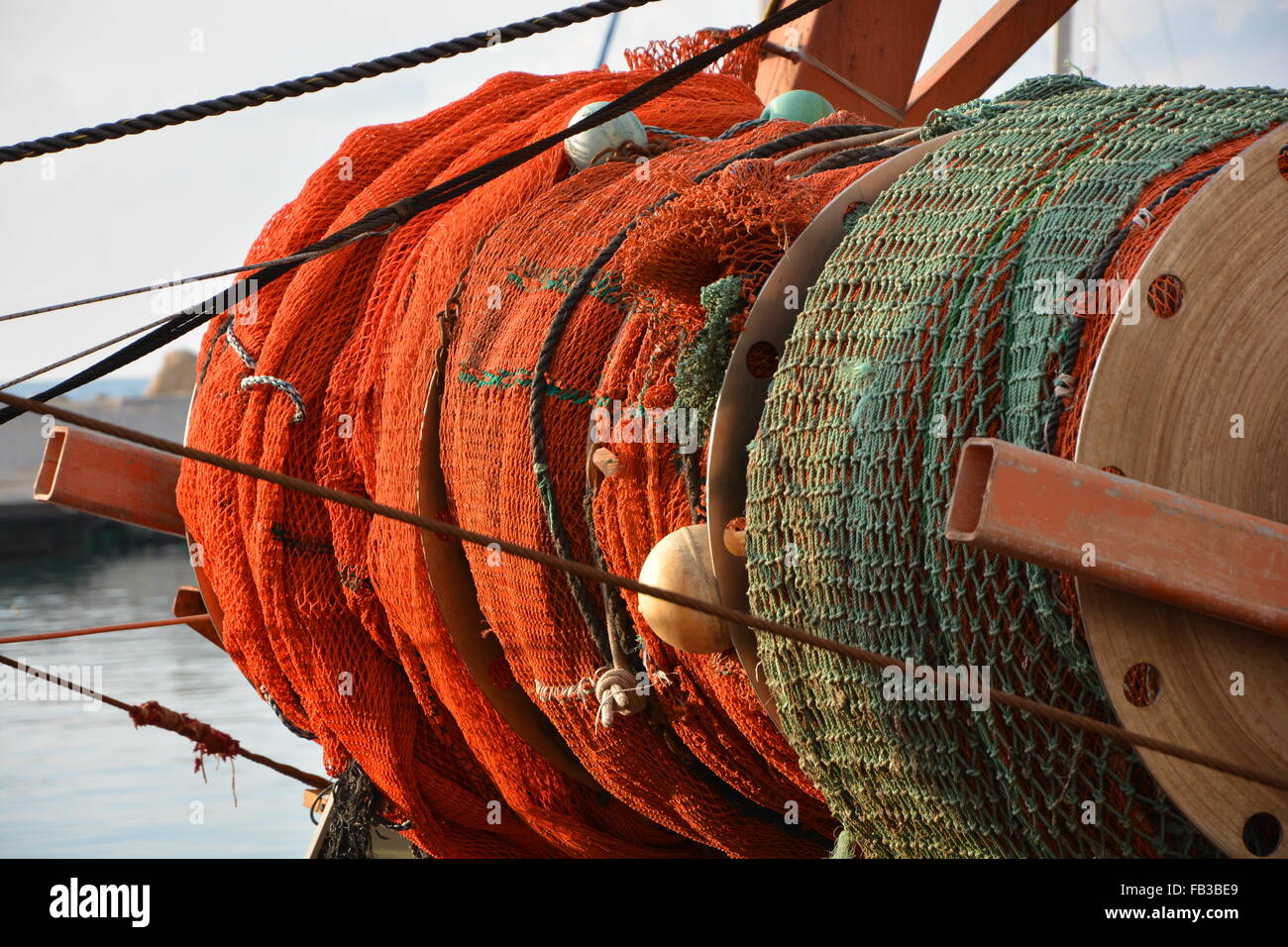 rolled fishing net end of the day Stock Photo - Alamy