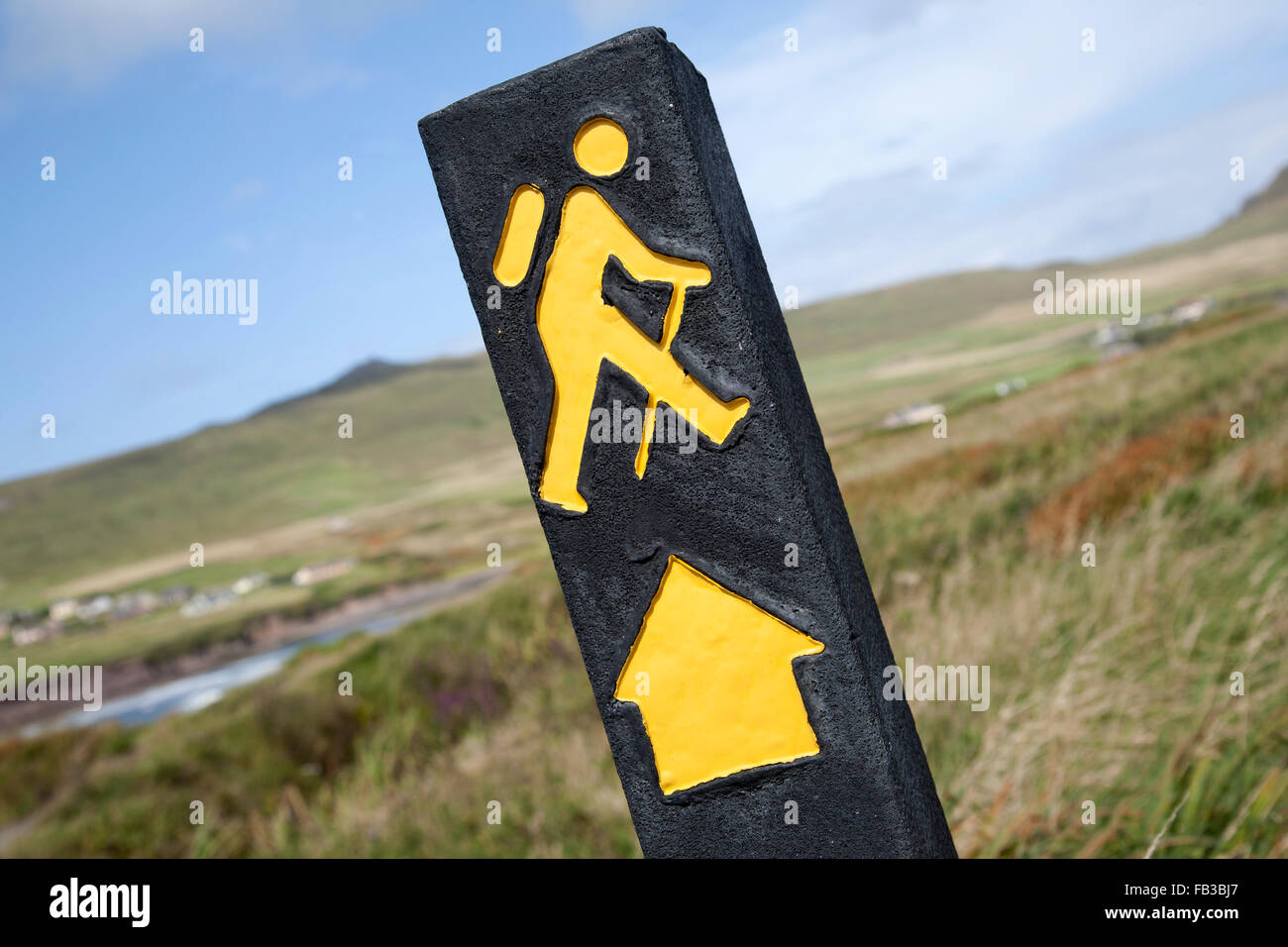 Yellow Hiking Sign with Rural Background Stock Photo - Alamy