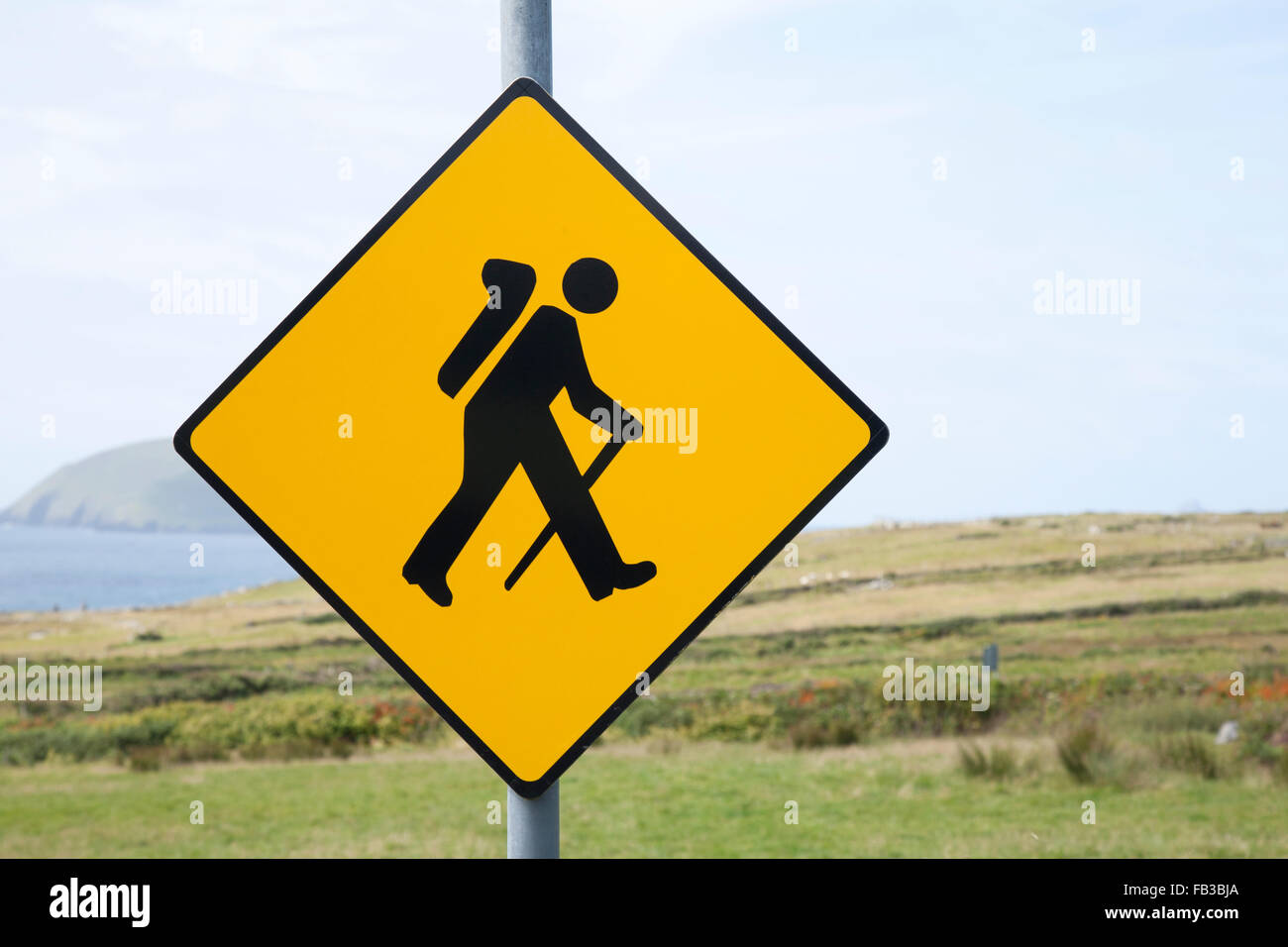 Yellow Hiking Sign with Coastal Background Stock Photo - Alamy