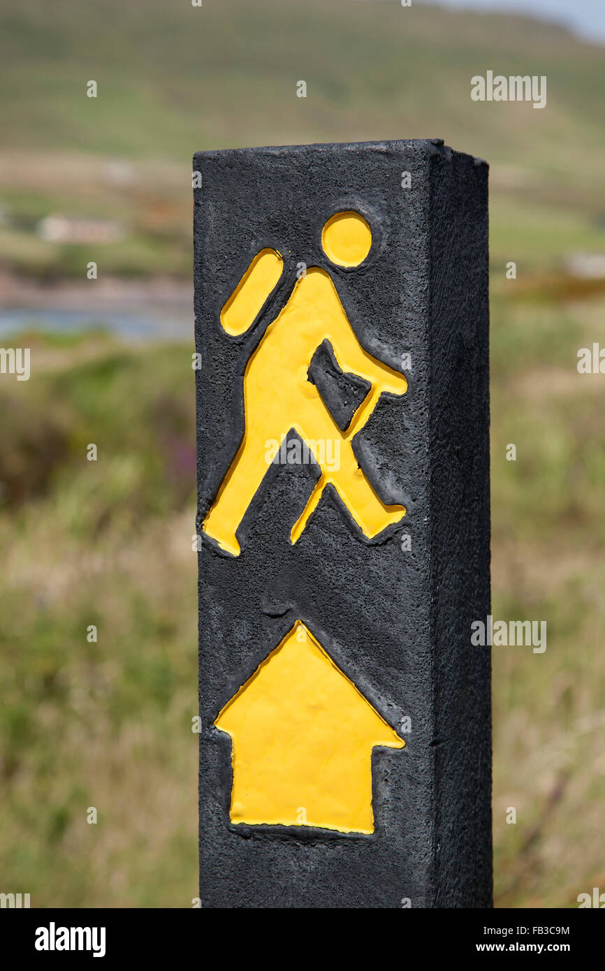 Yellow Hiking Sign with Rural Background Stock Photo - Alamy