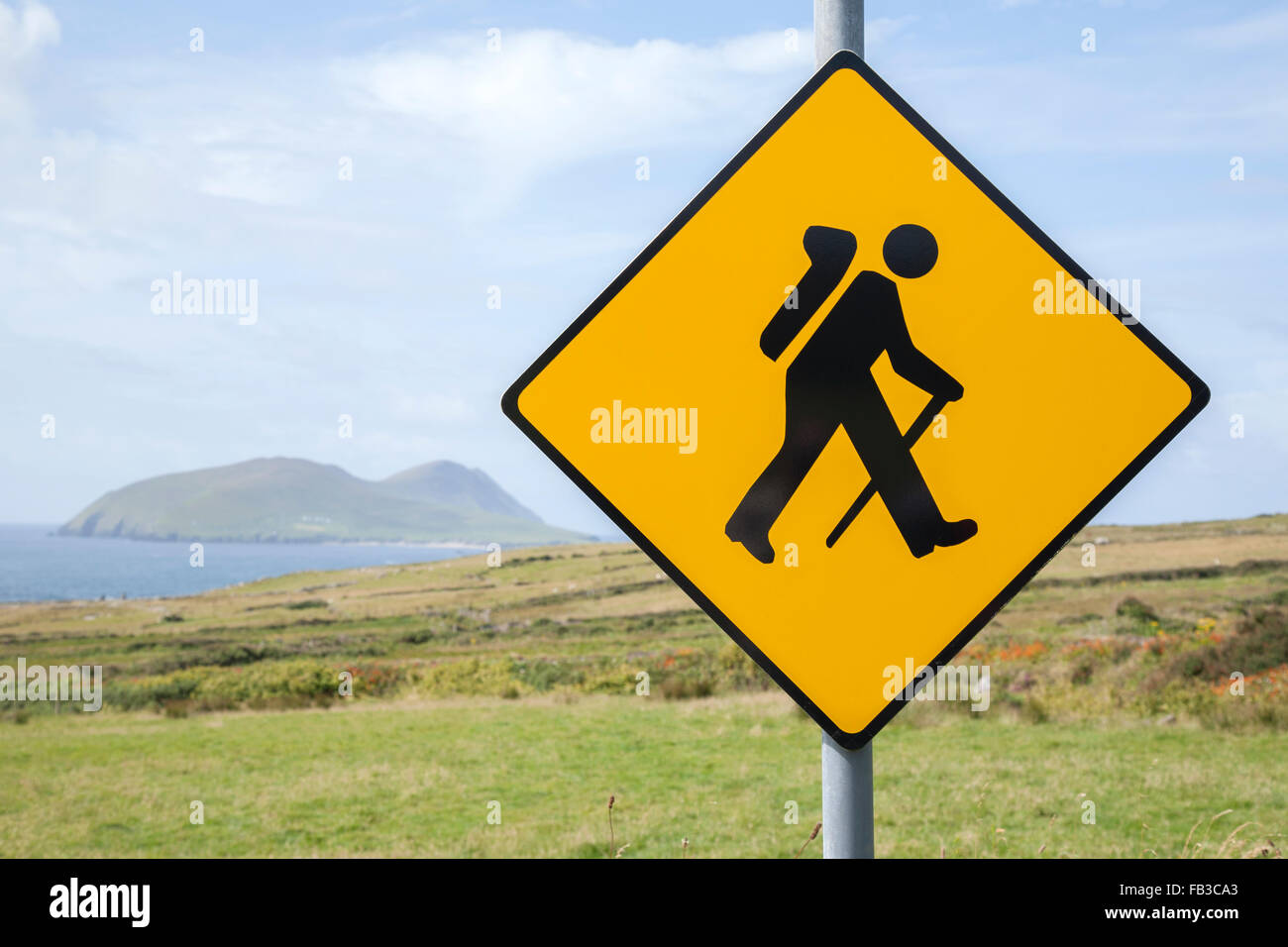 Yellow Hiking Sign with Coastal Background Stock Photo - Alamy